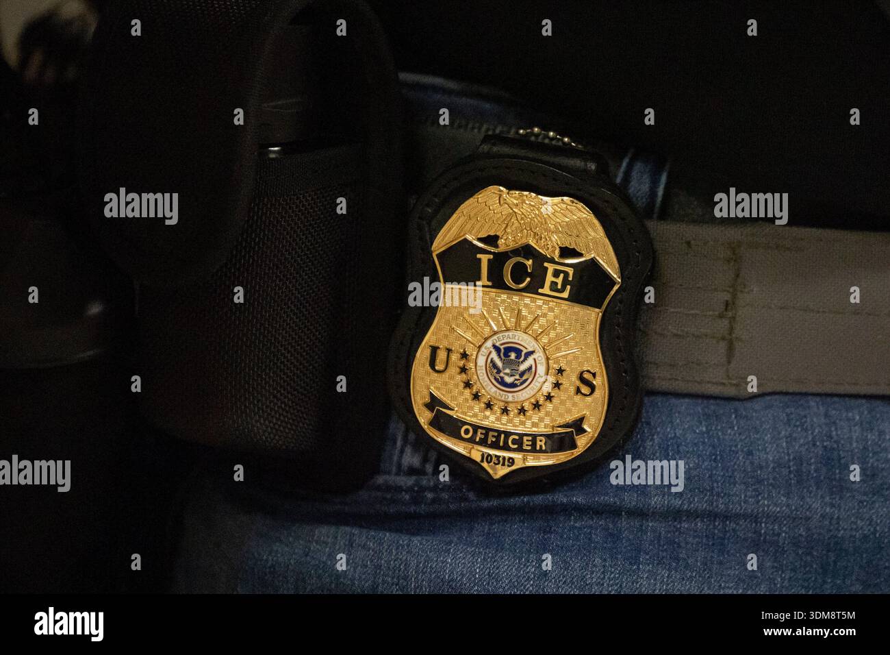 FILE - A federal agent wears an Immigration and Customs Enforcement ...