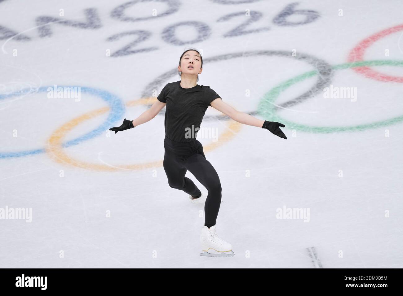 Ruiyang Zhang, of China, performs during a figure skating training ...