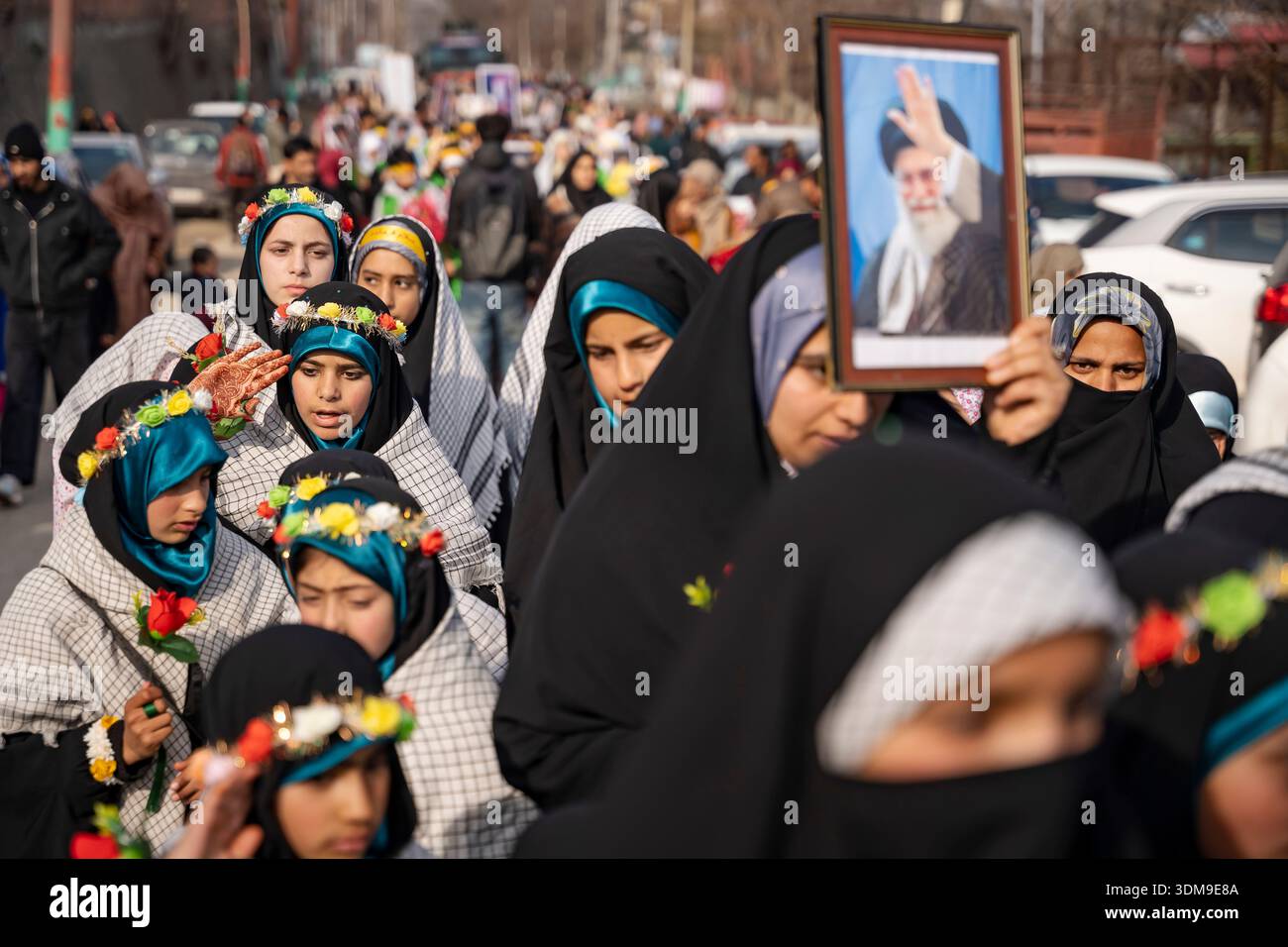 Kashmiri Shia Muslim girls hold photographs of Iranian leader Ayatollah ...