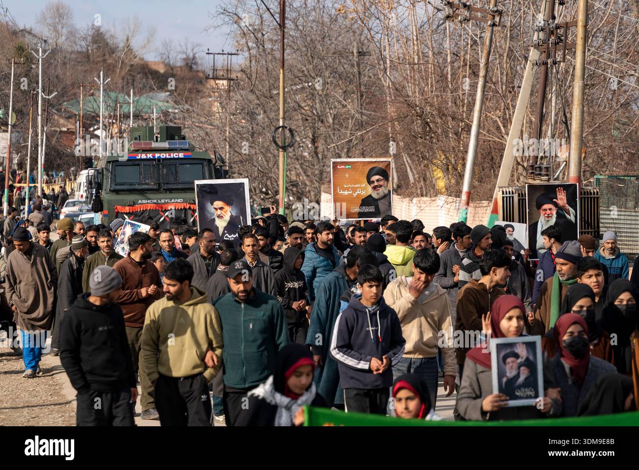 Kashmiri Shia Muslims hold photographs of Iranian leader Ayatollah Ali ...