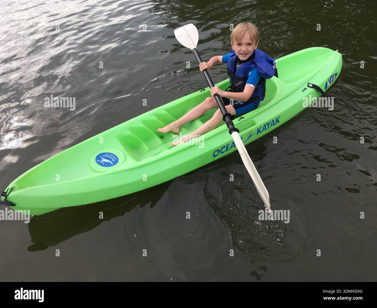 Young boy alone in a kayak on Decoy Lake, Decoy Country Park, Newton ...