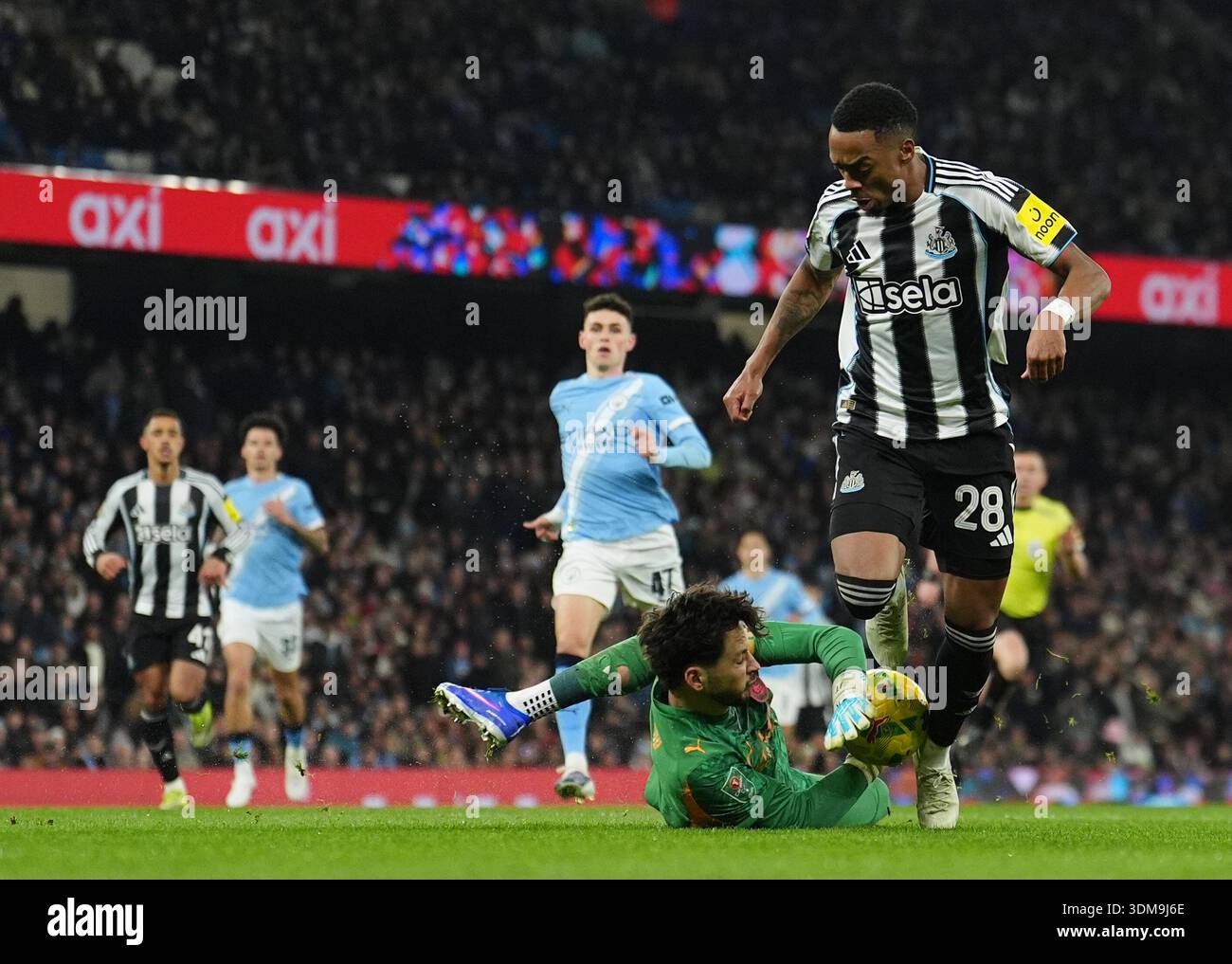 Manchester City goalkeeper James Trafford saves at the first of ...