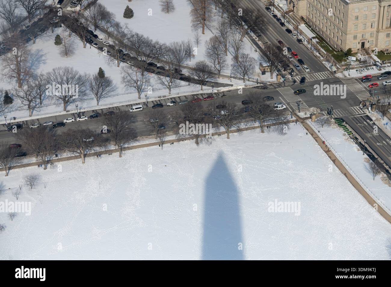 The shadow of the Washington Monument is seen after a recent snow storm ...