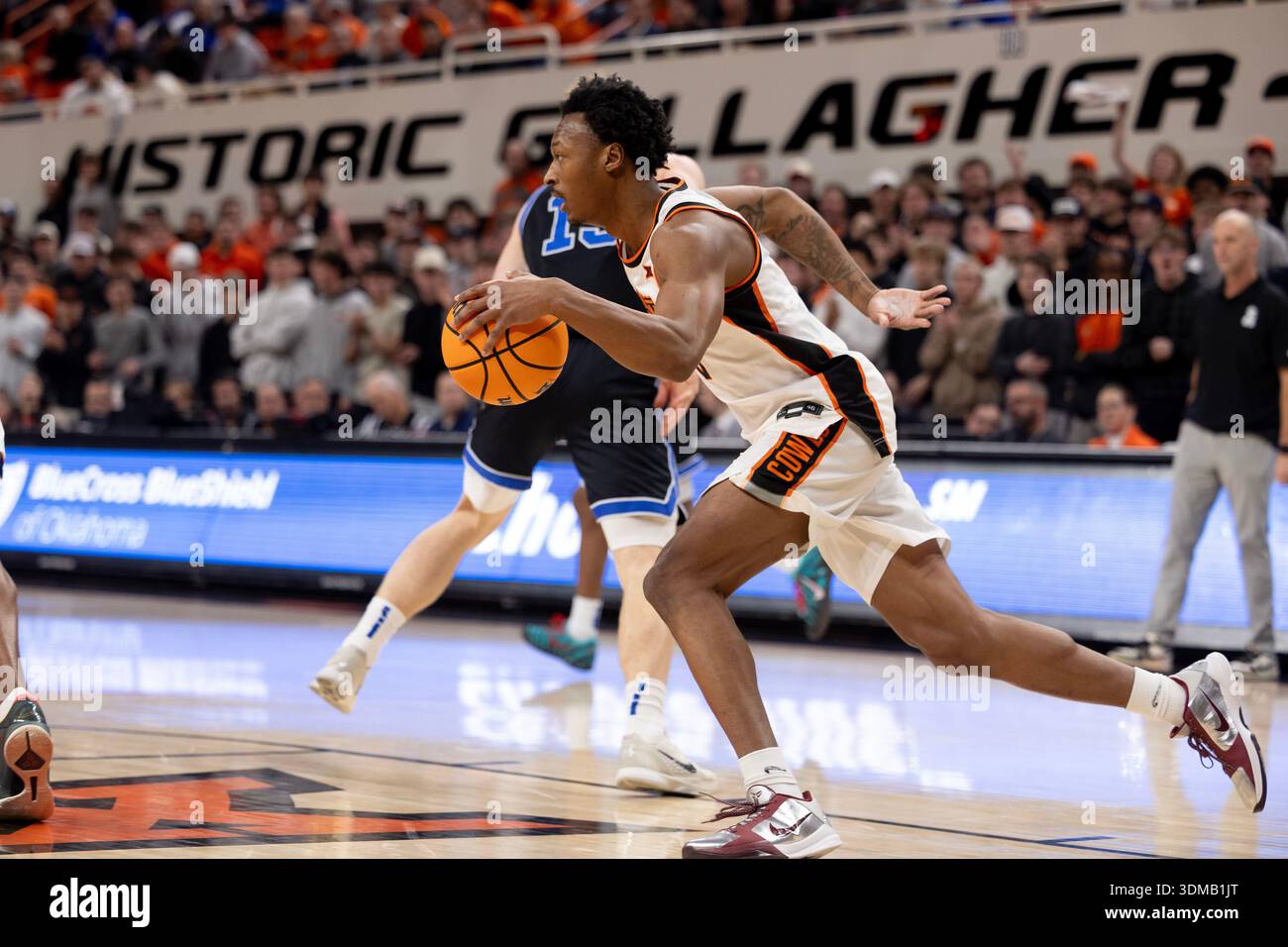 Oklahoma State guard Anthony Roy (9) brings the ball up the court in ...