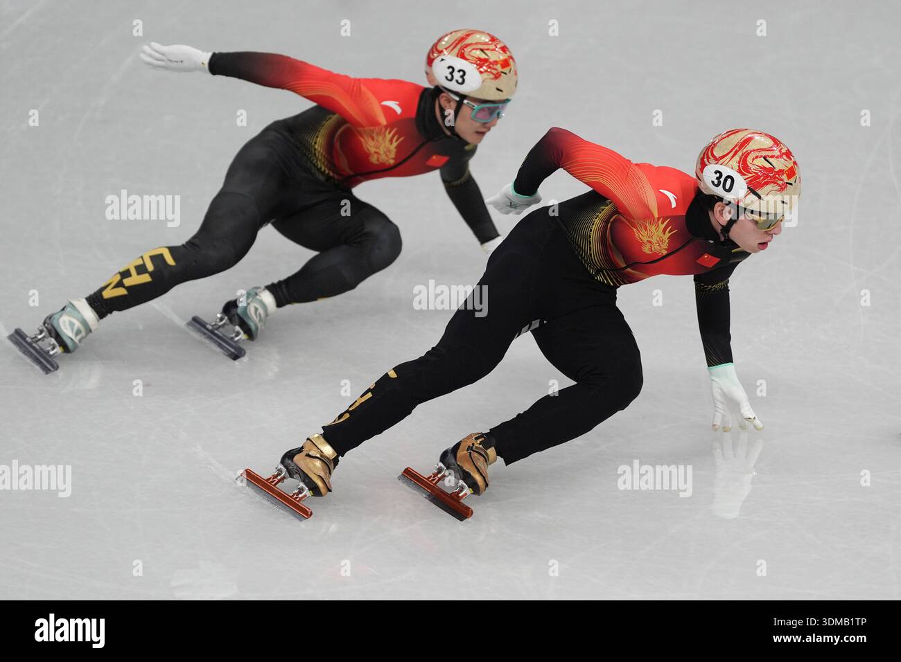 Chinese short track speed skater Lin Xiaodong (R) and Li Wenlong in the ...