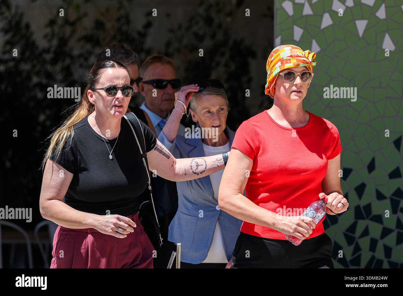 NSW Police Inspector Amy Scott (right) departs the Lidcombe Coroners ...