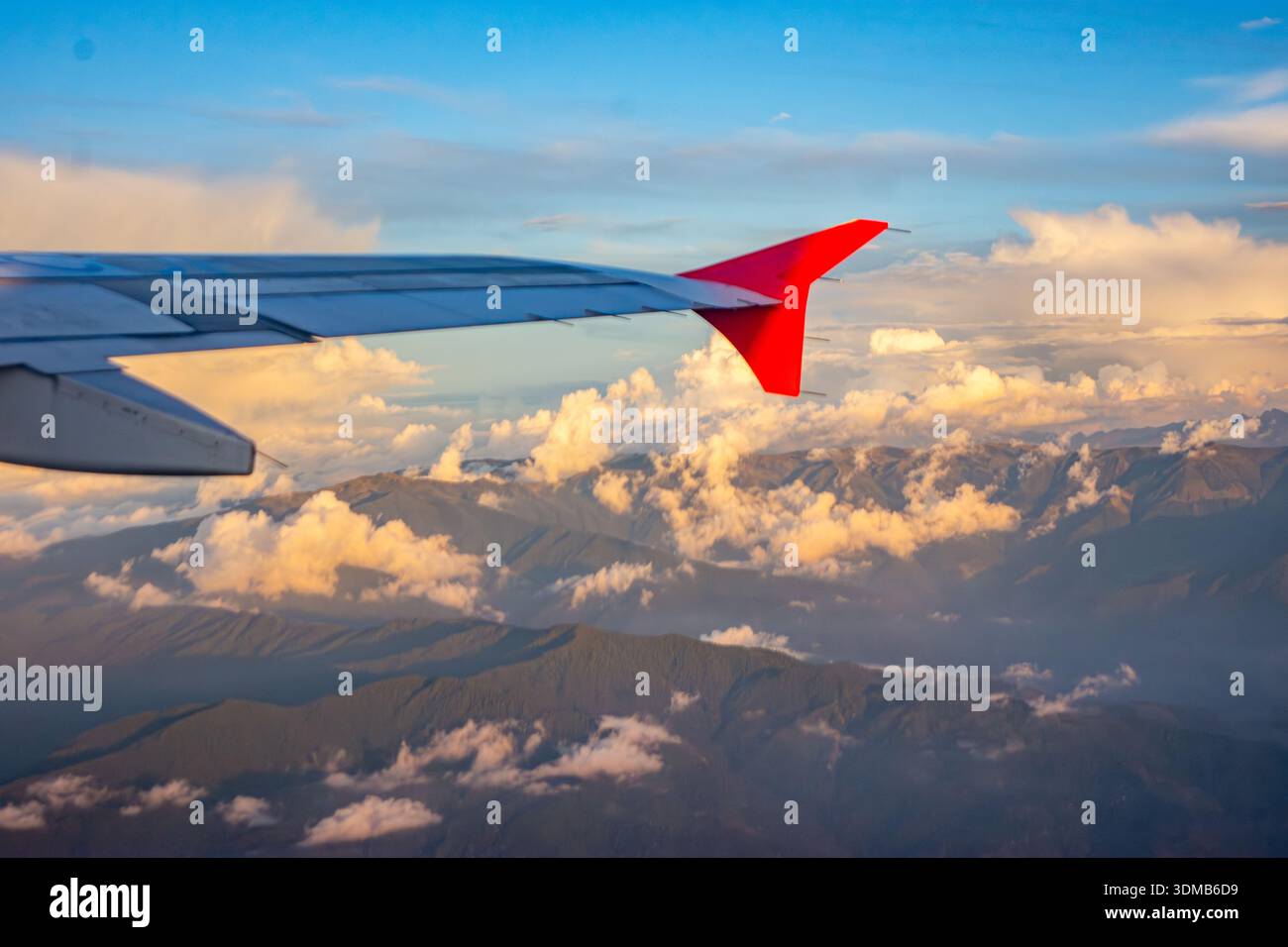Airplane cuts through clouds hi-res stock photography and images - Alamy