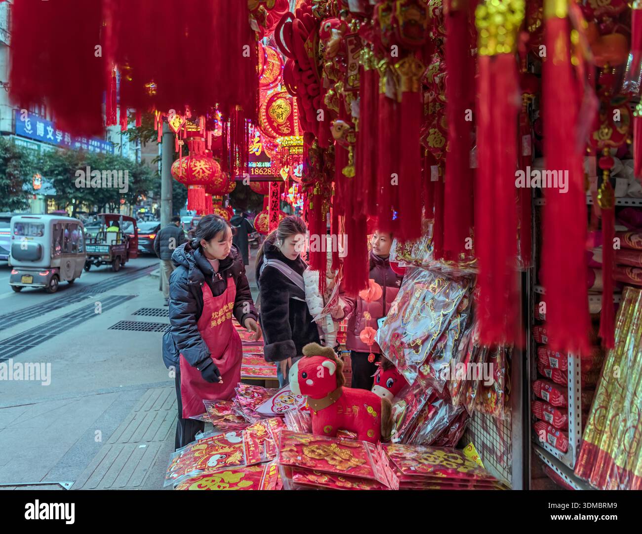 Residents shop for Lunar New Year decorations at a night market in ...