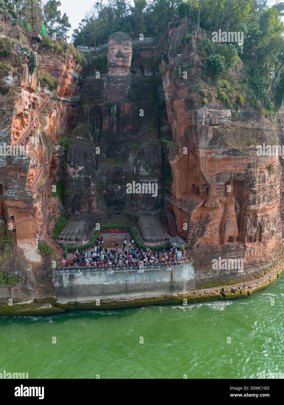 Tourists visit the Leshan Giant Buddha scenic area in Leshan City ...