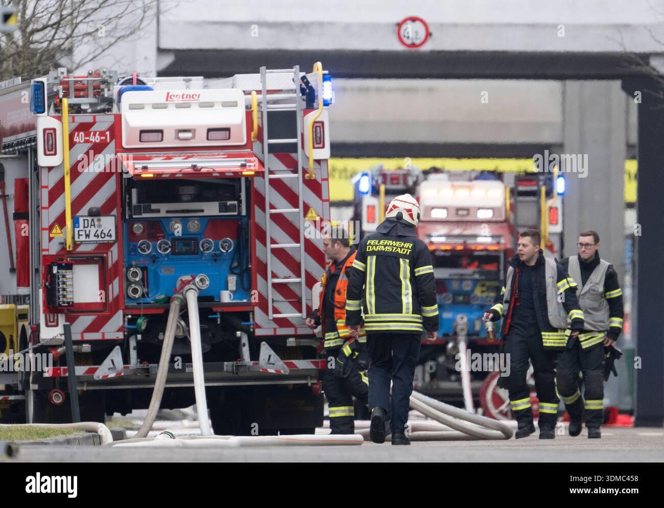 05 February 2026, Hesse, Darmstadt-Wixhausen: Firefighters fight a fire ...