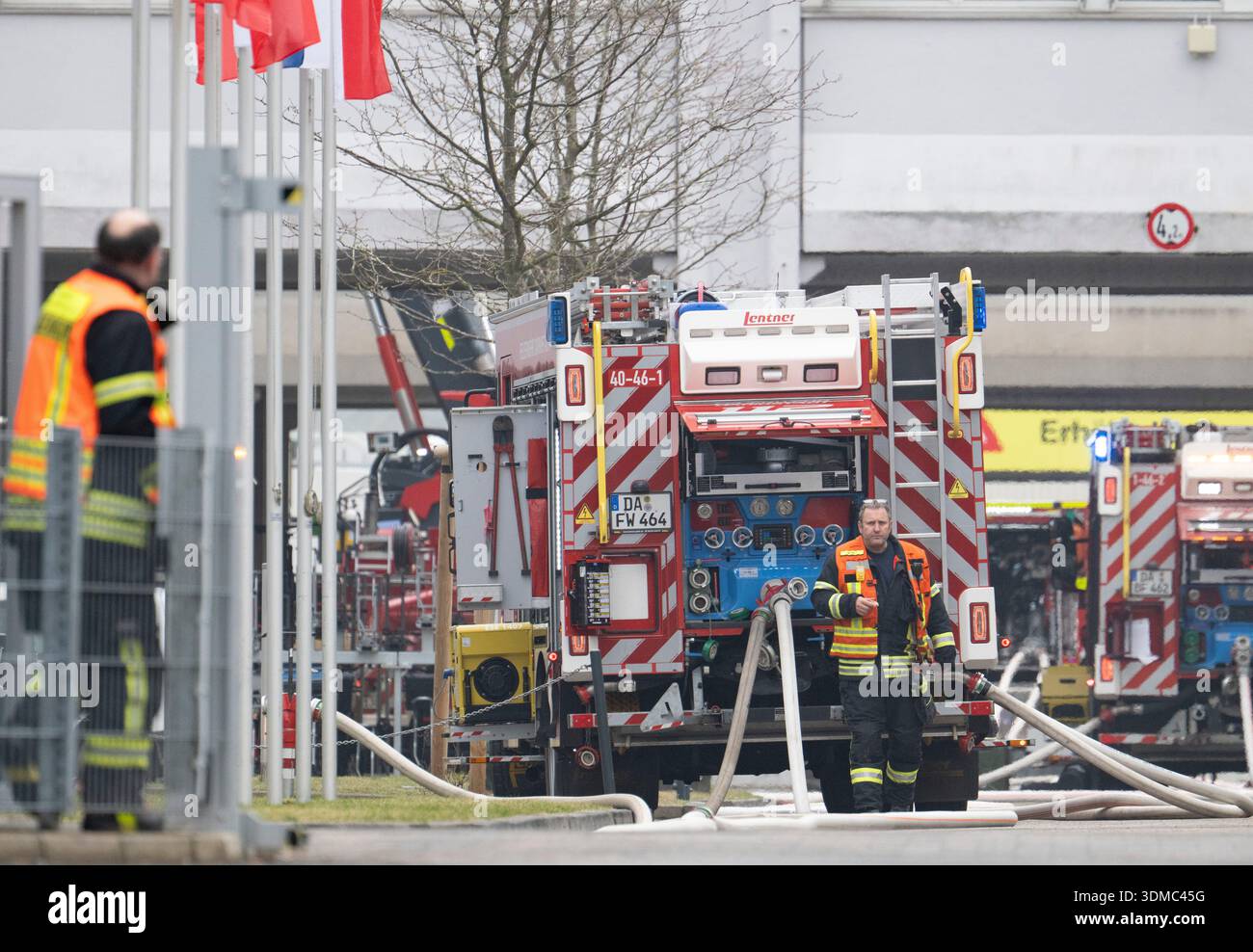 05 February 2026, Hesse, Darmstadt-Wixhausen: Firefighters fight a fire ...