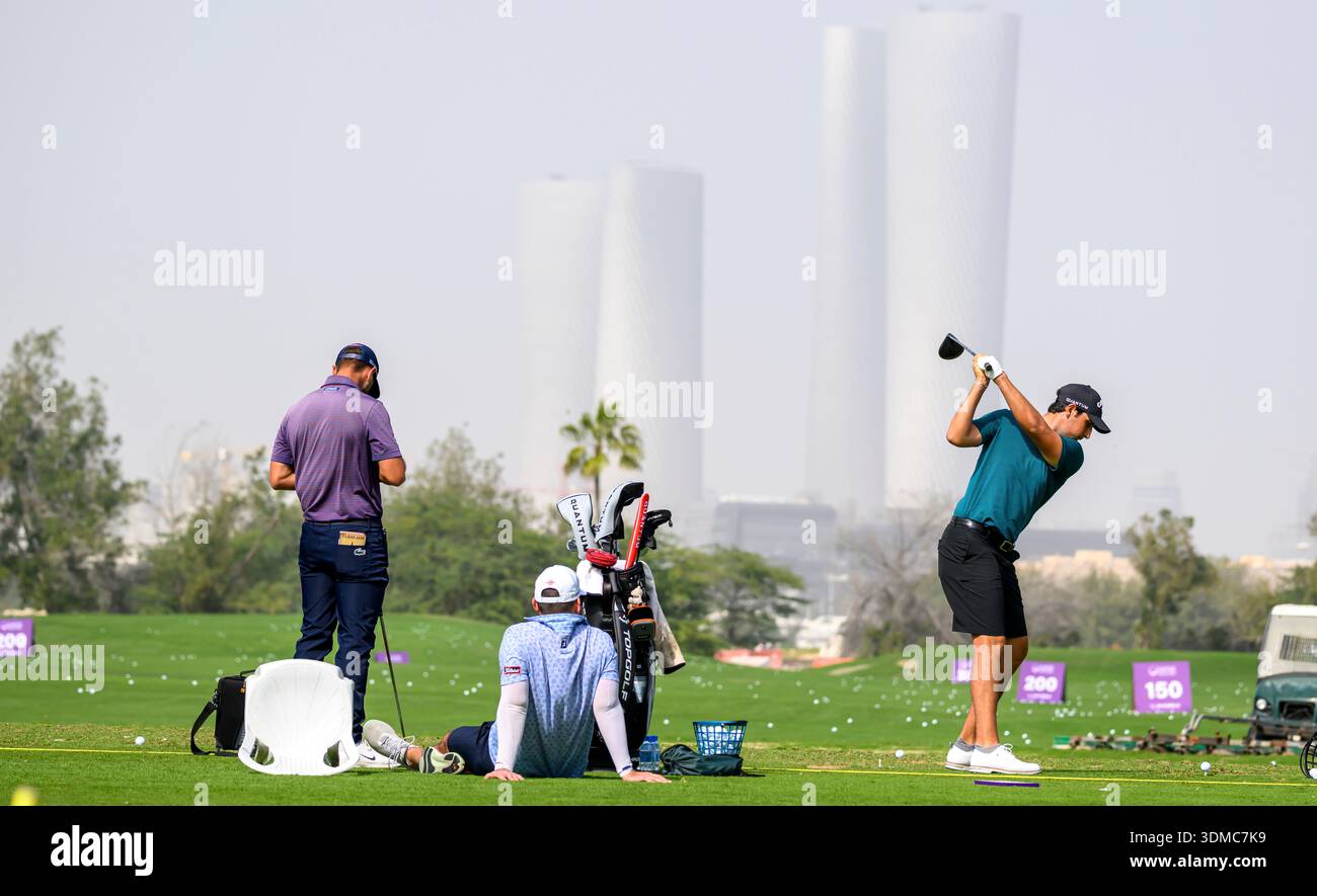 Golfers are seen during a practice session ahead of the Qatar Masters ...