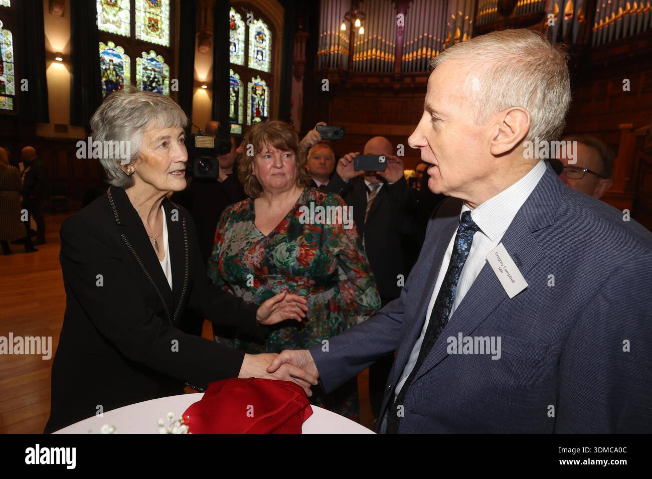 President of Ireland Catherine Connolly (left) shakes hands with ...