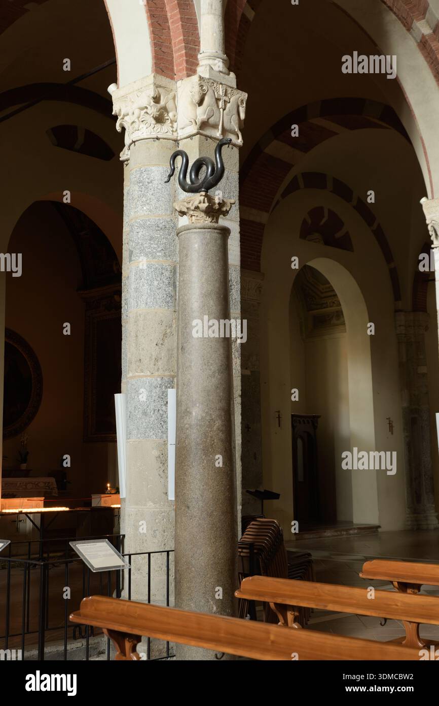 Bronze serpent on column and Romanesque capital in Basilica of Sant ...