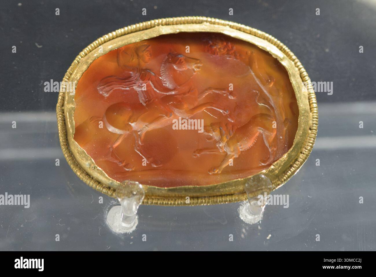 oman carnelian intaglio of a horseman hunting a lion, gold frame ...