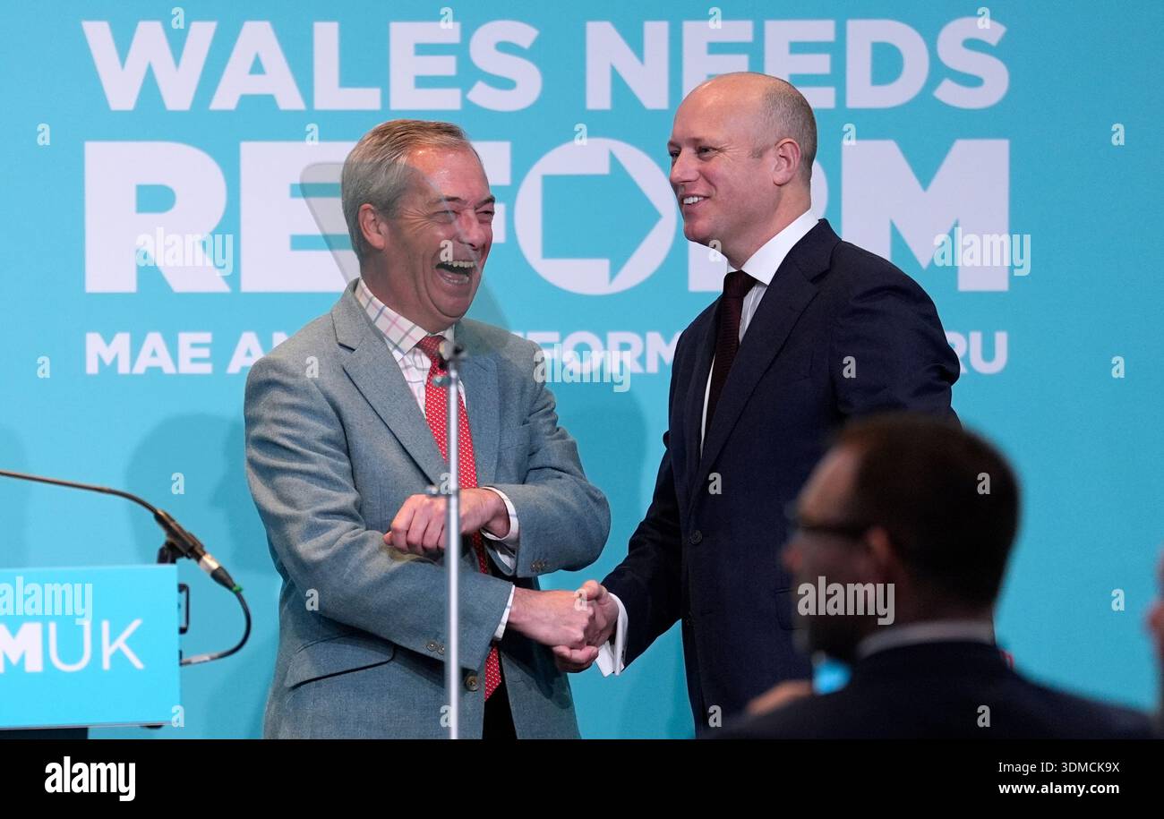 Reform UK leader Nigel Farage (left) greets new leader of Reform UK in ...