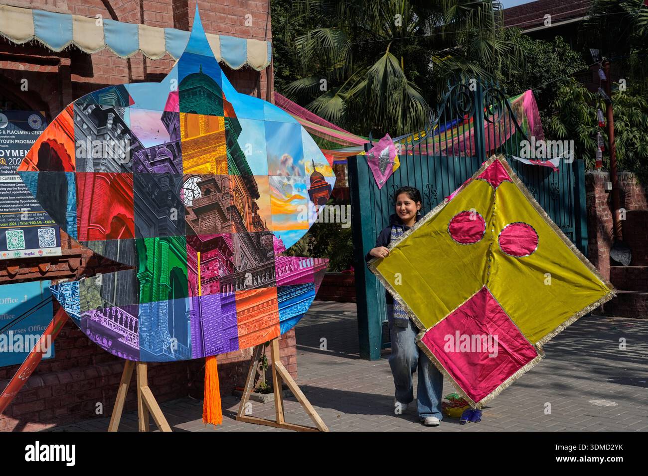 A student decorates her university campus with a variety of kites ahead ...