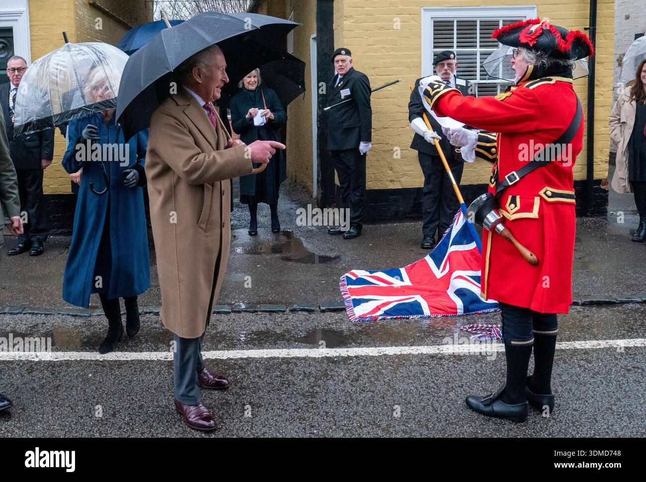 King Charles III points to a town crier during the royal visit to ...