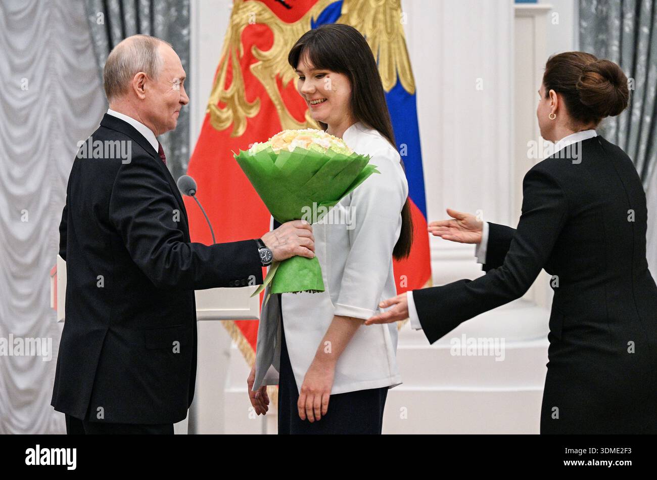 Russian President Vladimir Putin (left) and Victoria Vedyushkina ...