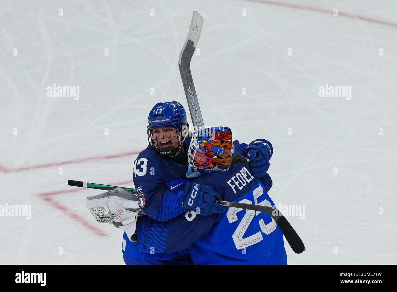 Italy's Laura Lobis (13) and Martina Fedel (25) celebrate after winning ...