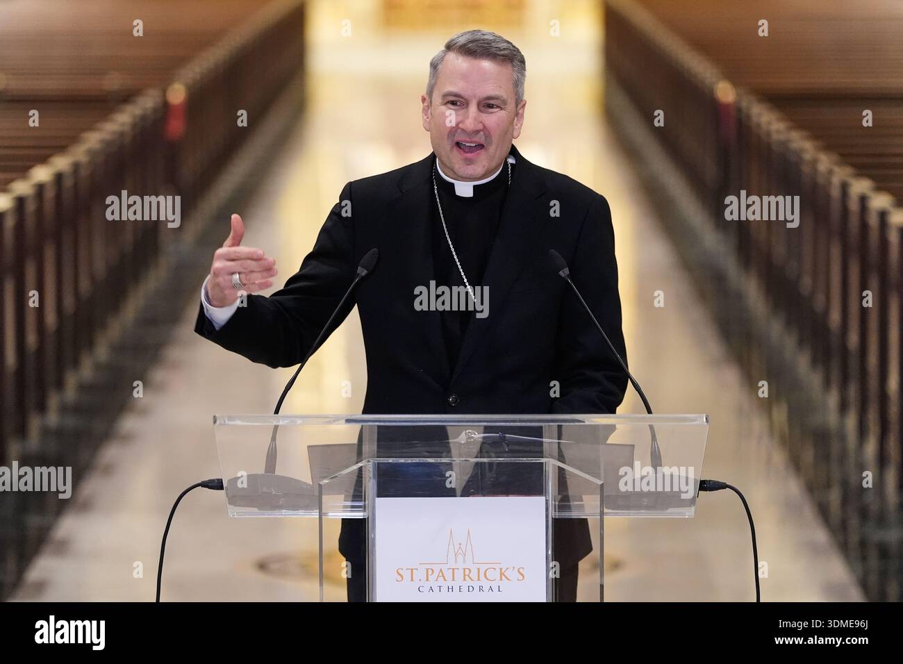 Archbishop-designate Ronald Hicks talks to reporters during a news ...