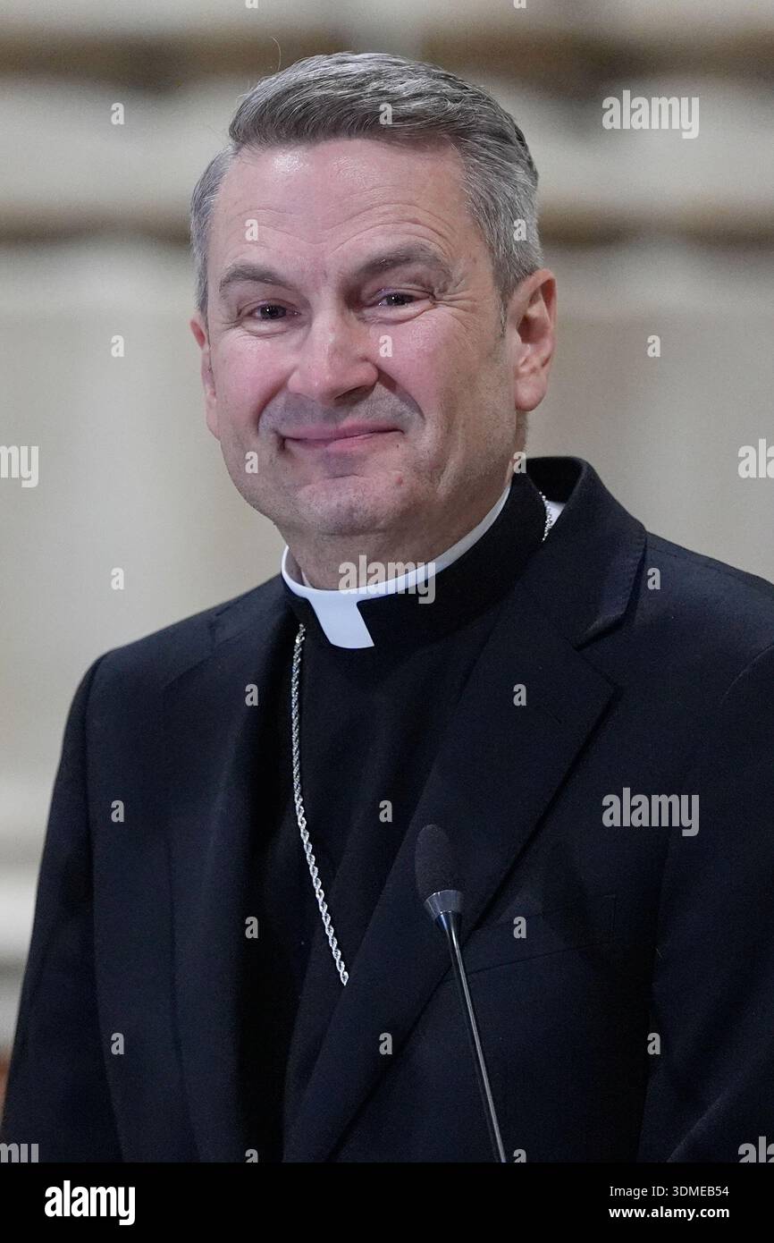 Archbishop-designate Ronald Hicks talks to reporters during a news ...