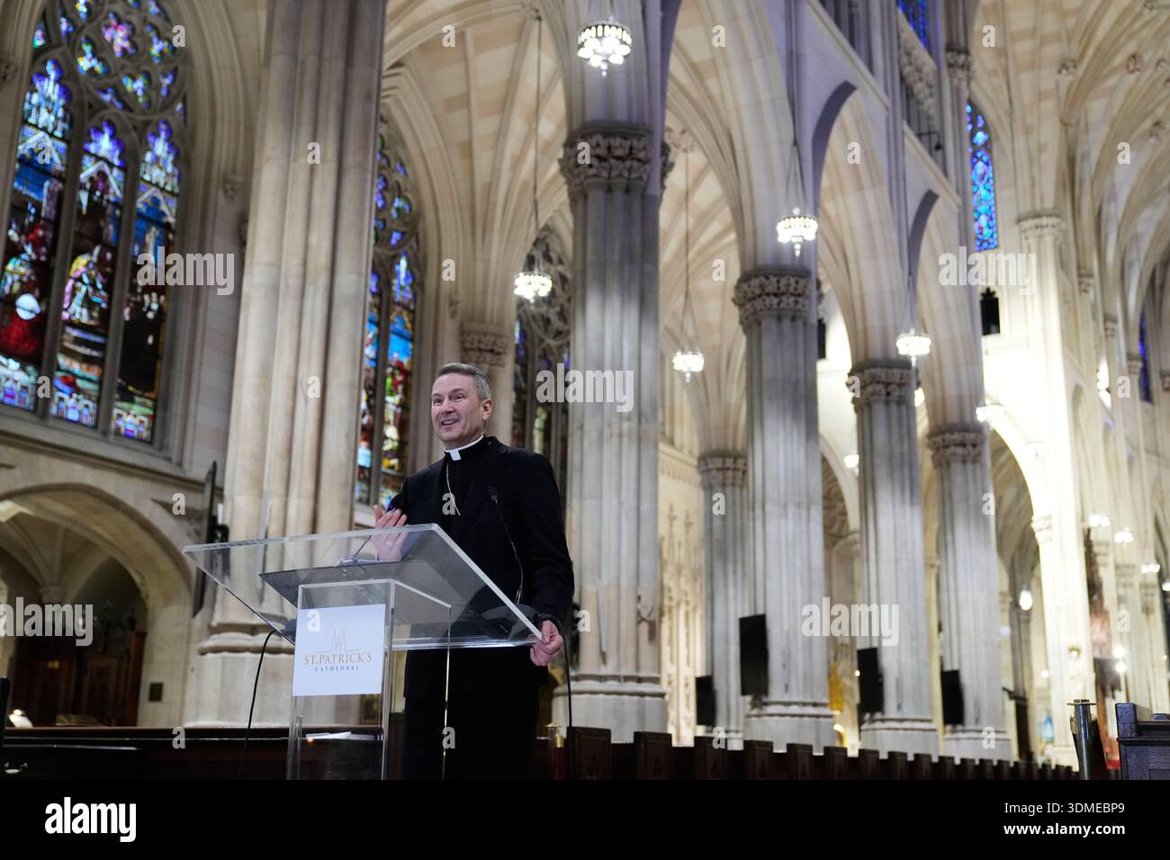 Archbishop-designate Ronald Hicks talks to reporters during a news ...