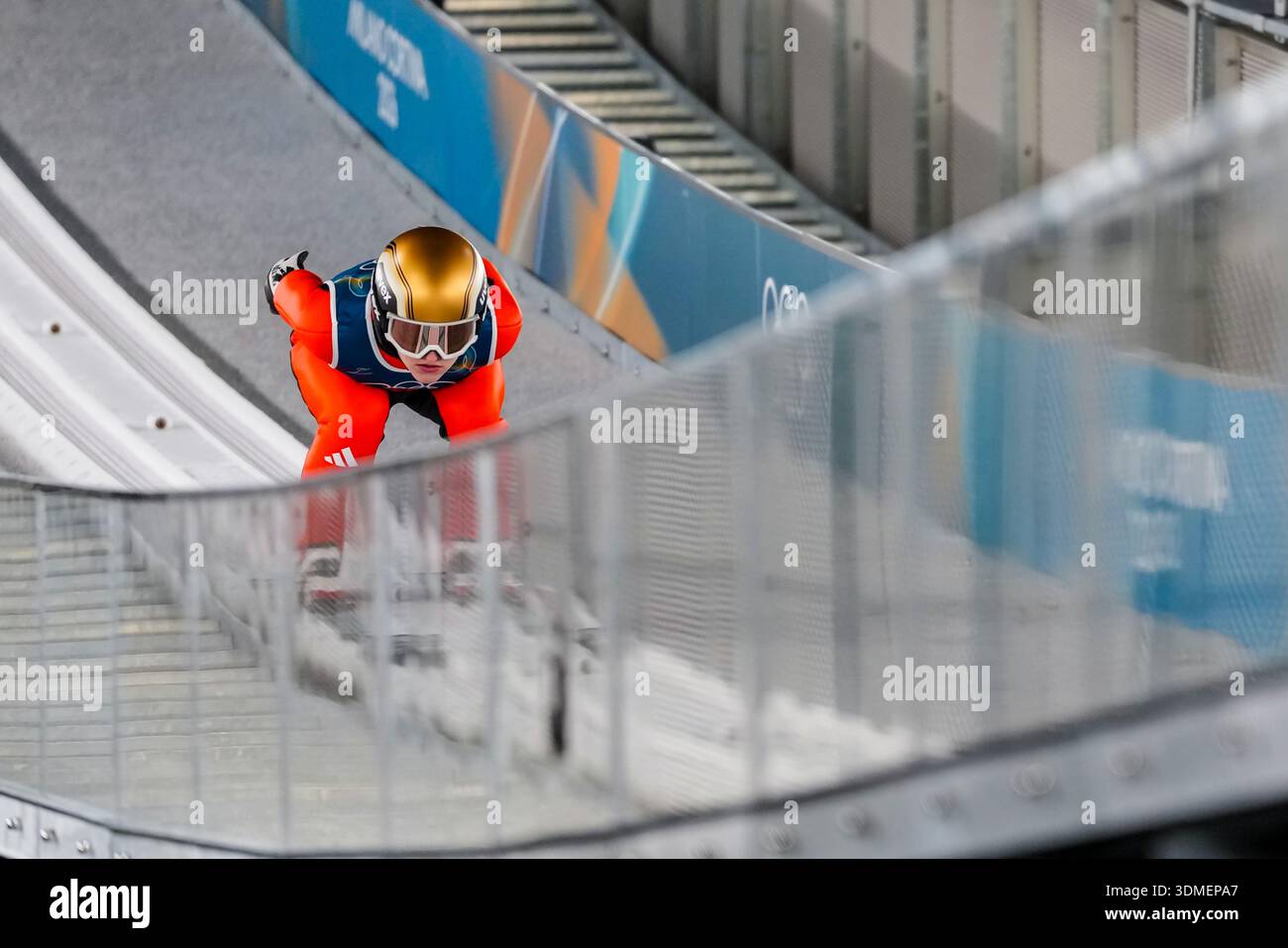 Heidi Dyhre Traaserud, of Norway, goes down the ramp during a ski ...