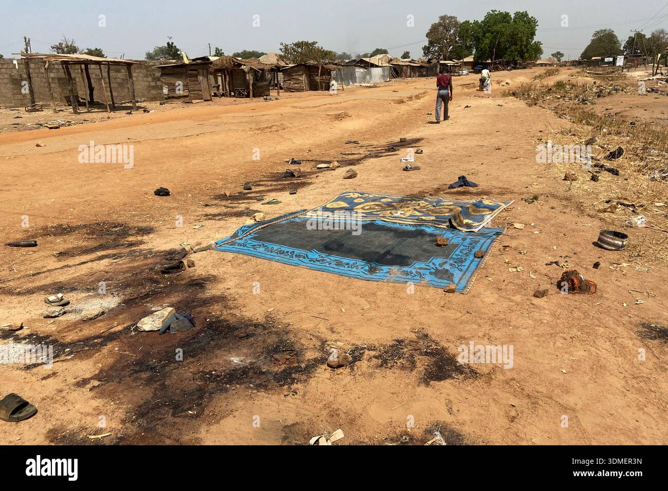 Blood stains cover the ground, days after an attack on the village of ...