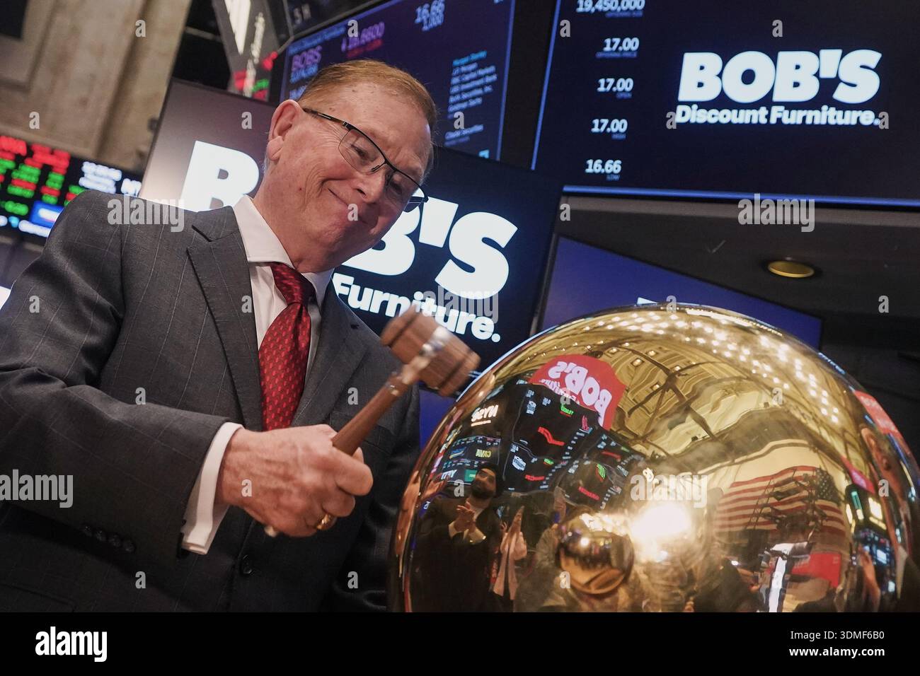 Bob's Discount Furniture President & CEO Bill Barton rings a ceremonial ...