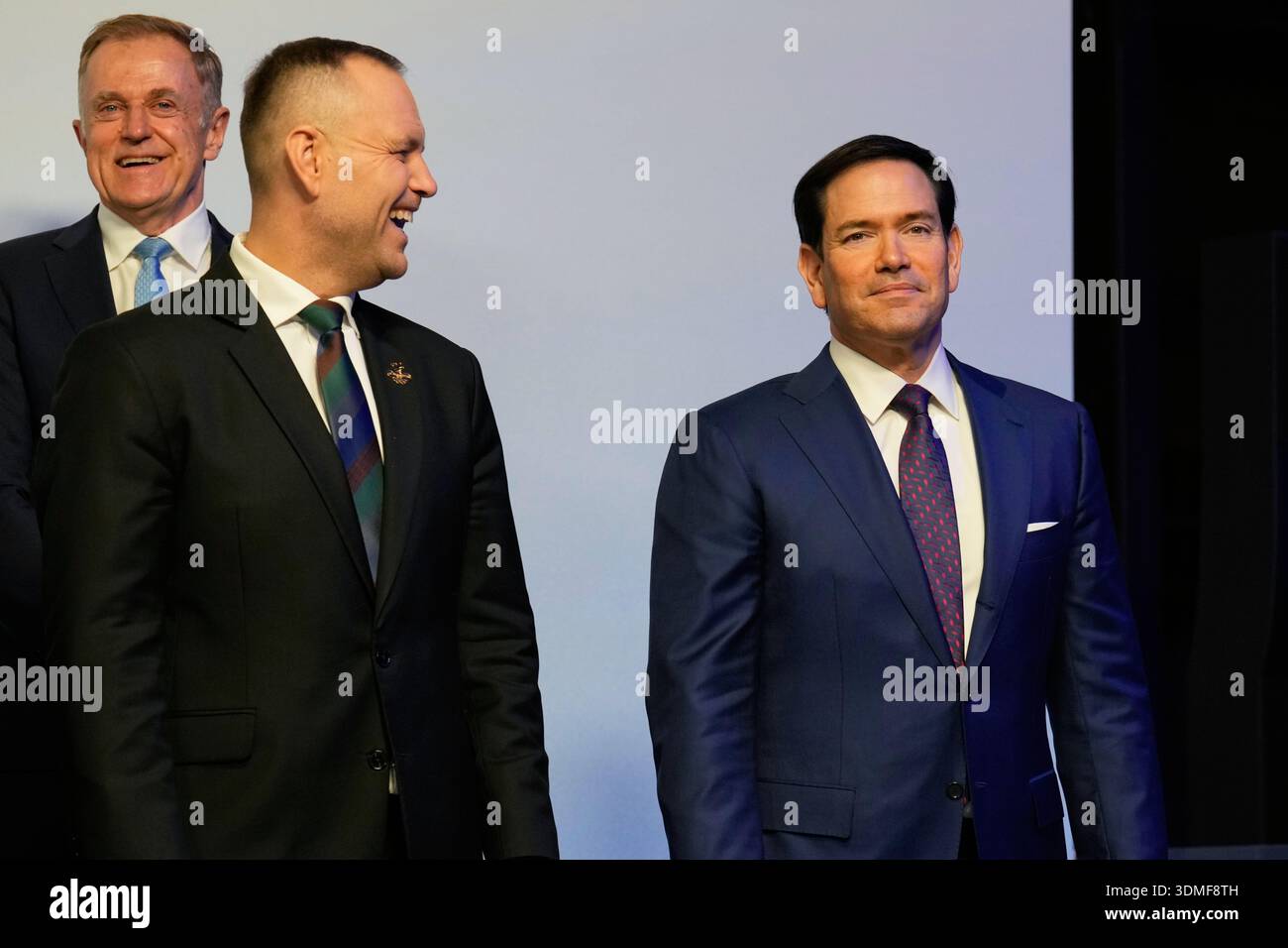 U.S. Secretary of State Marco Rubio, right, looks on ahead of a group ...