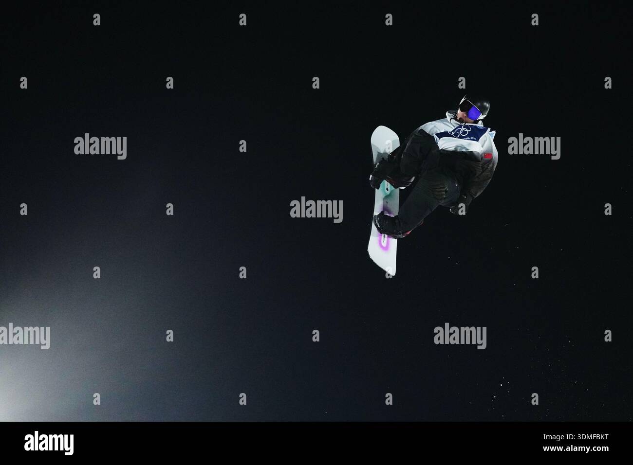 China's Ge Chunyu competes in men's snowboard big air qualifications at ...
