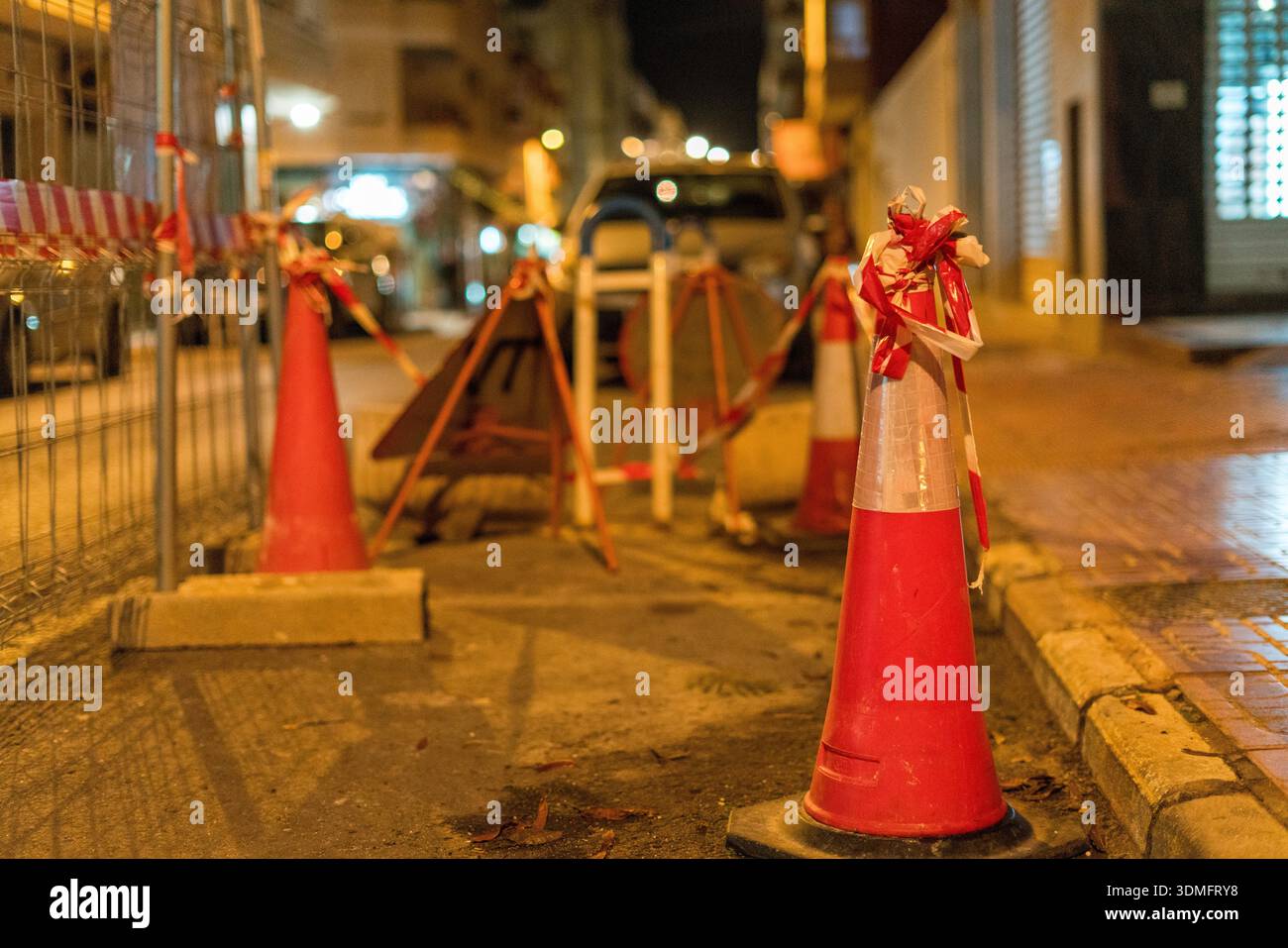 Road cones blocking street at night urban construction zone Stock Photo ...