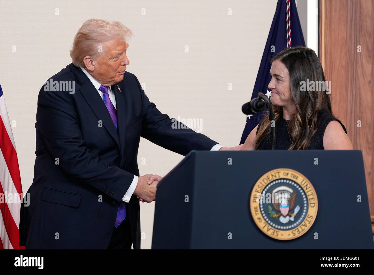 President Donald Trump shakes hands with Catherine Rayner during an ...