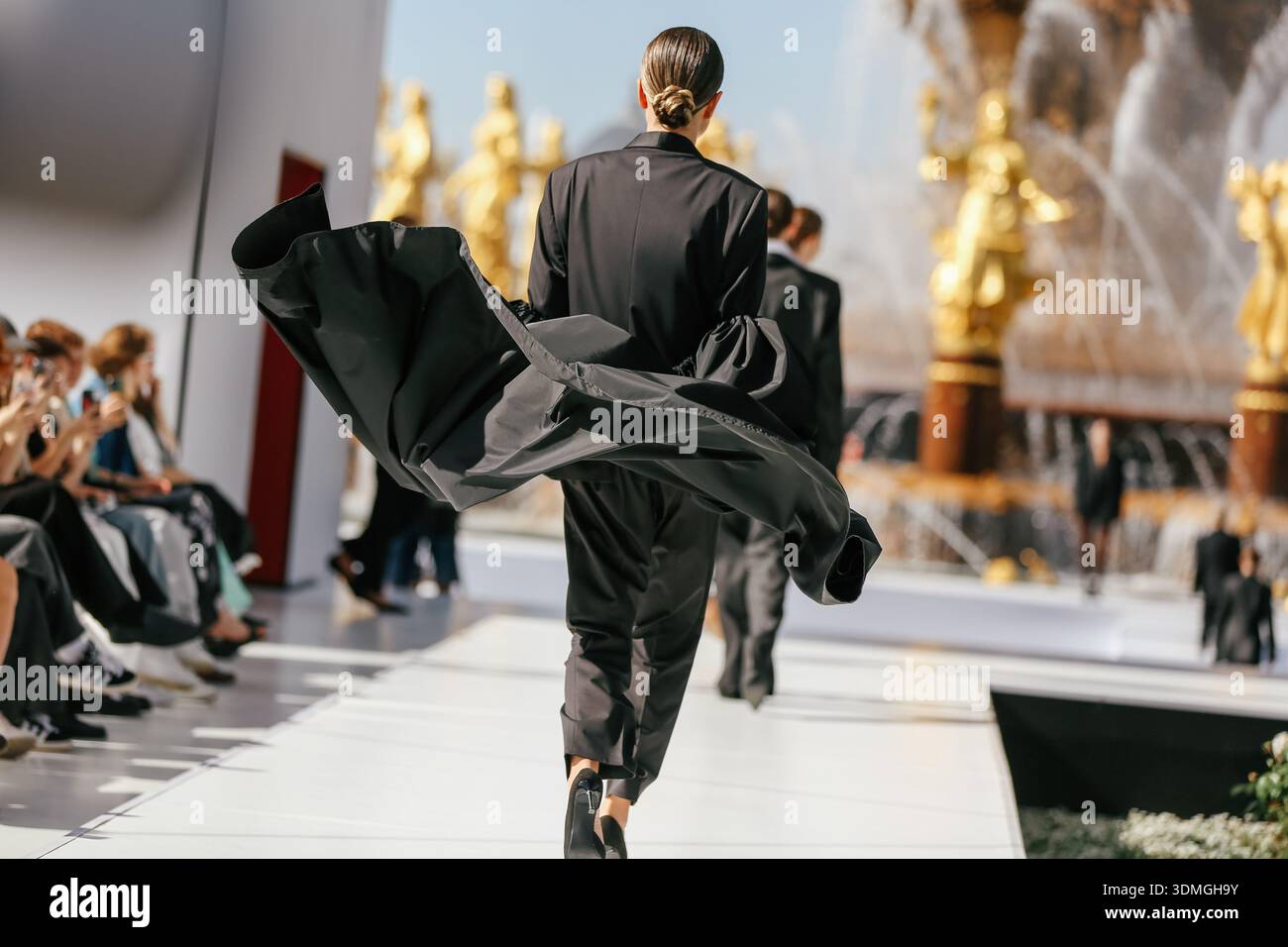 August 30, 2025, Moscow, Russia: Models walk the outdoor runway during ...