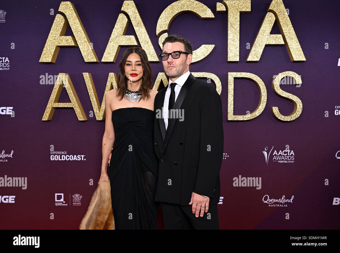 Joel Edgerton (right) and partner Christine Centenera (left) are seen ...