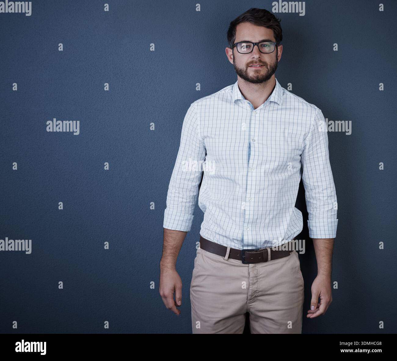 Portrait, man and fashion with glasses in studio with pride, ambition ...