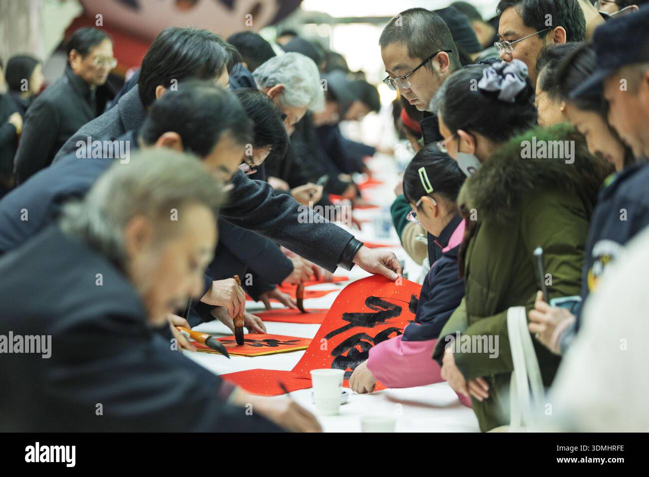 Calligraphers write and gift 'Fu' characters to people, symbolizing New ...