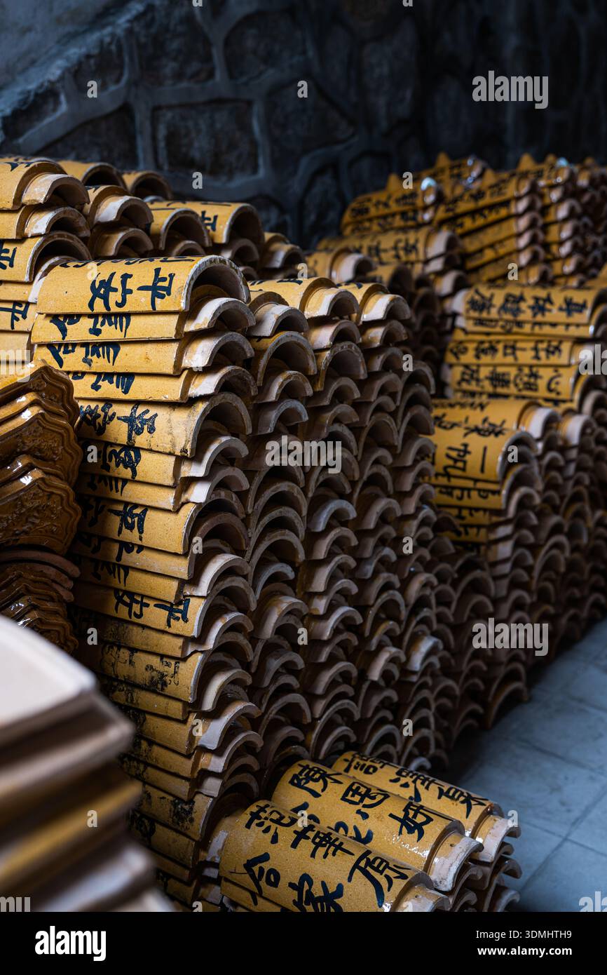 Traditional Chinese temple roof tiles with calligraphy Stock Photo - Alamy