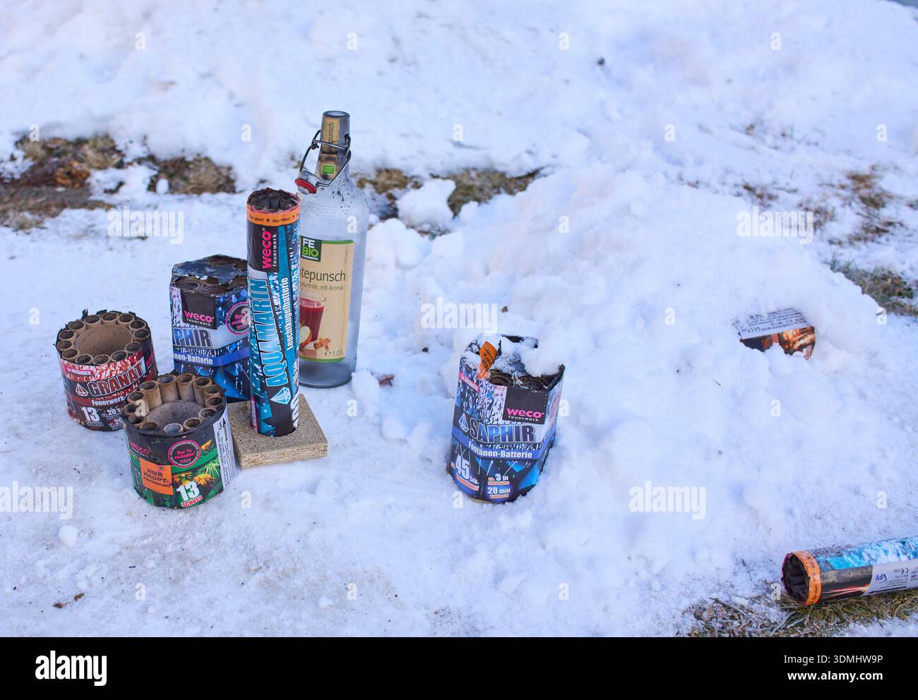 A scattered assortment of cardboard boxes filled with cylindrical ...