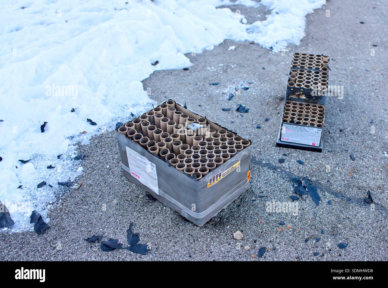 A scattered assortment of cardboard boxes filled with cylindrical ...