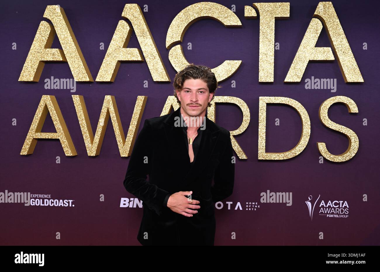 Ben Turland is seen posing for a photo on the red carpet at the 2024 ...