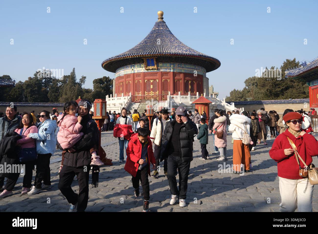 Visitors tour the Temple of Heaven to experience its grand imperial ...