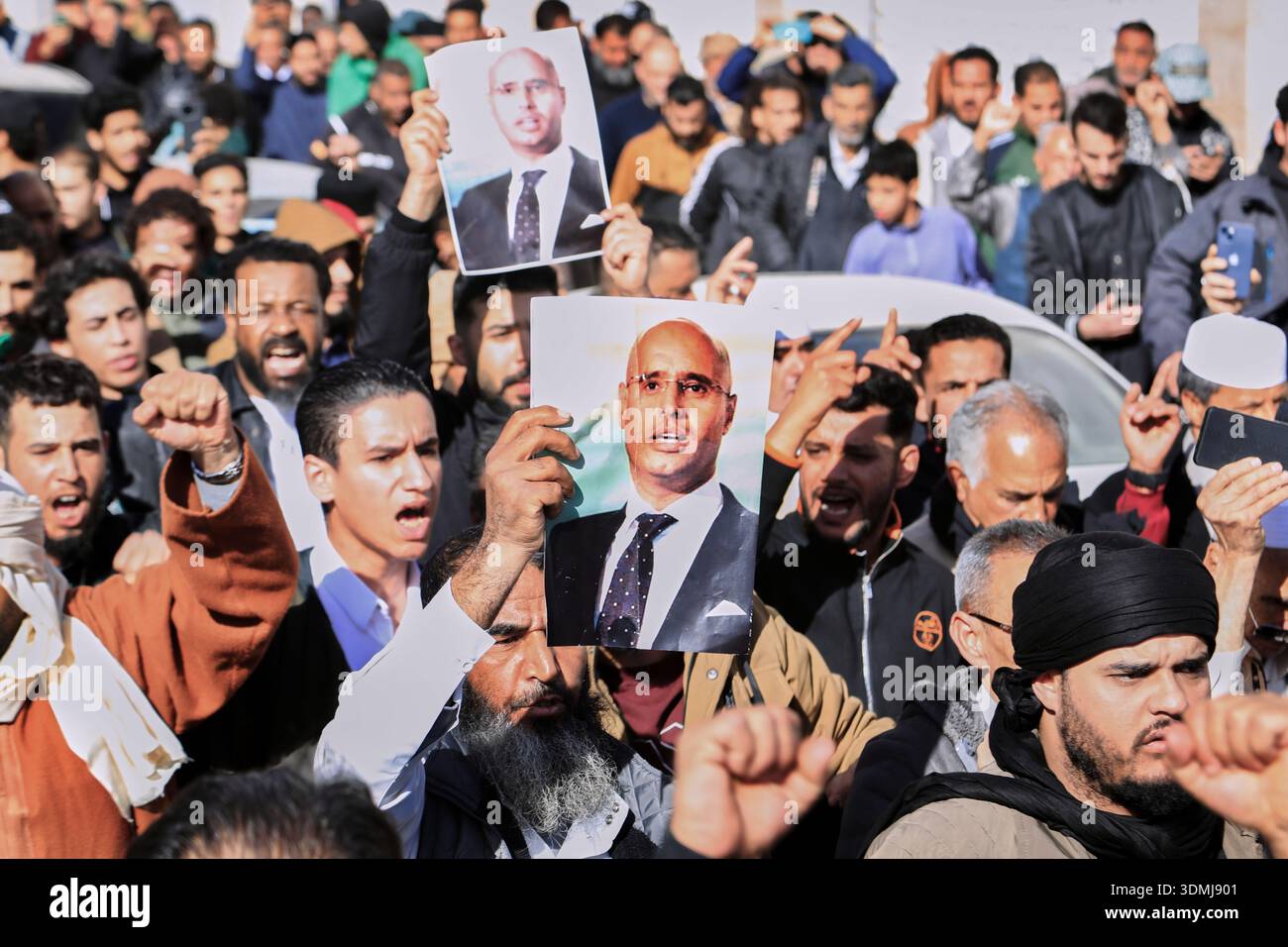 Libyans march to attend the funeral of Seif al-Islam, son of former ...