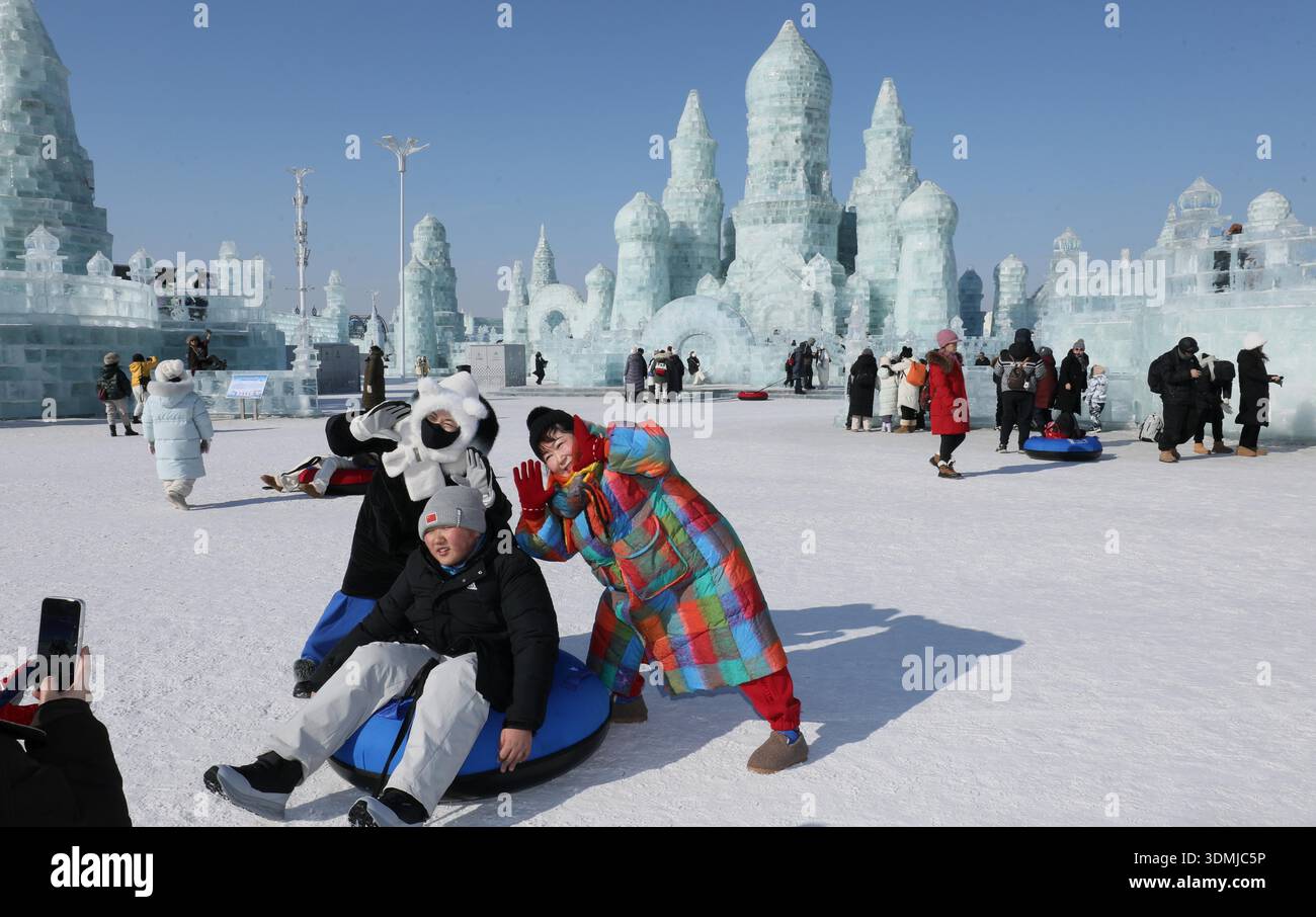 Visitors enjoy the 27th Harbin Ice and Snow World despite the cold ...