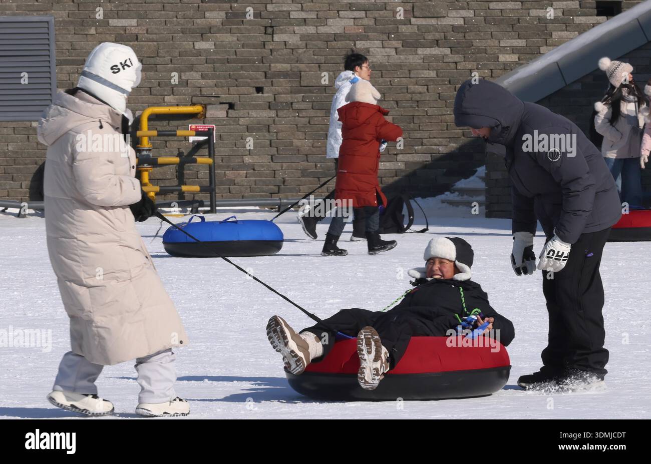 Visitors enjoy the 27th Harbin Ice and Snow World despite the cold ...