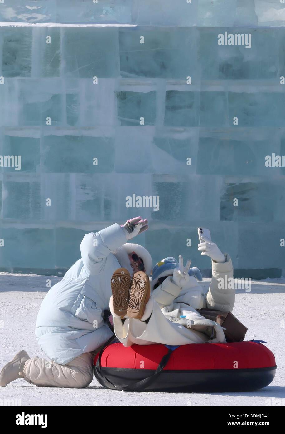 Visitors enjoy the 27th Harbin Ice and Snow World despite the cold ...