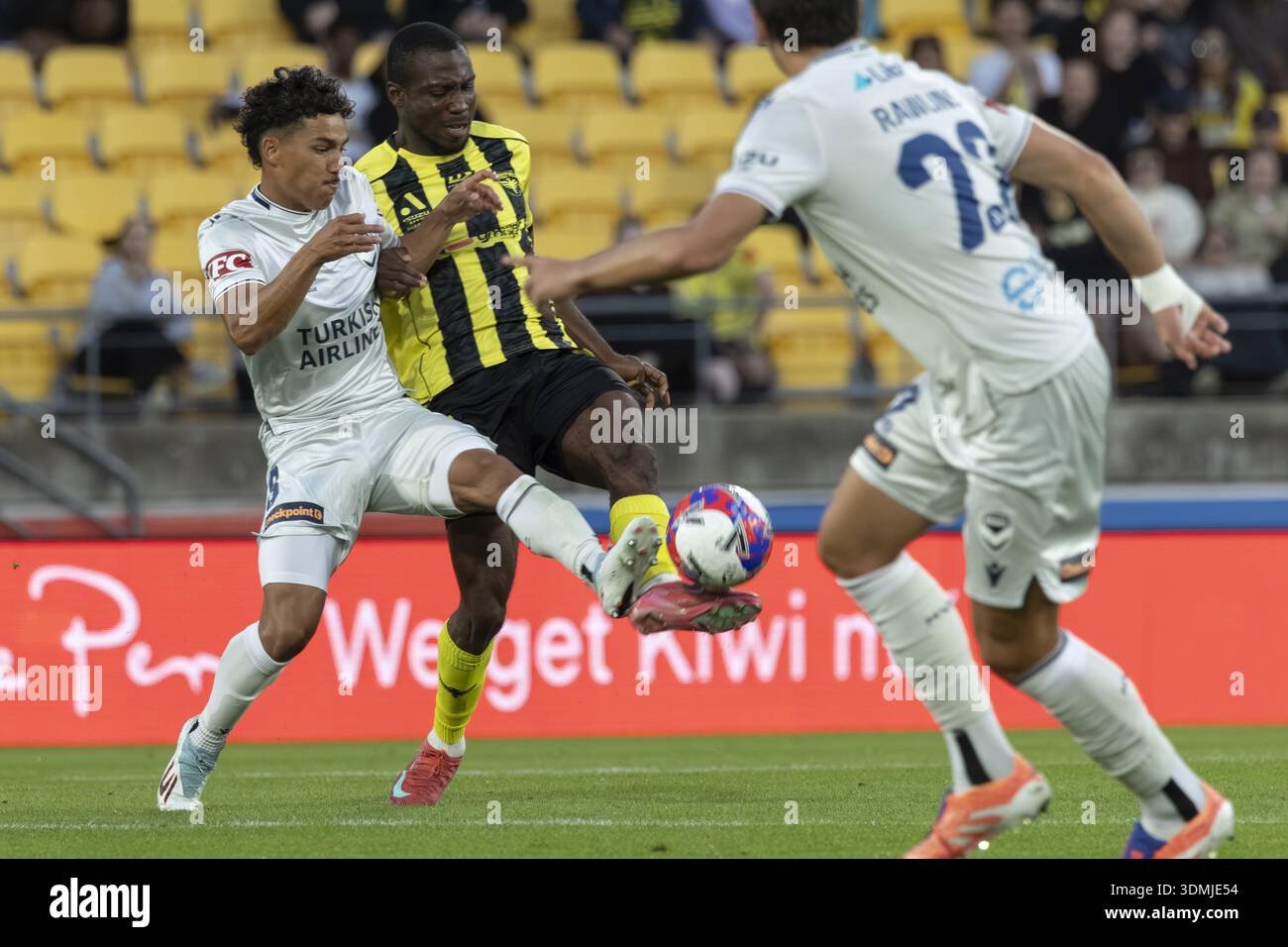 Legs lifted as Wellington striker Ifeanyi Eze and Melbourne midfielder ...
