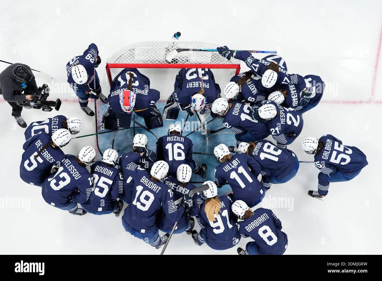 France players huddle before a preliminary round match of women's ice ...