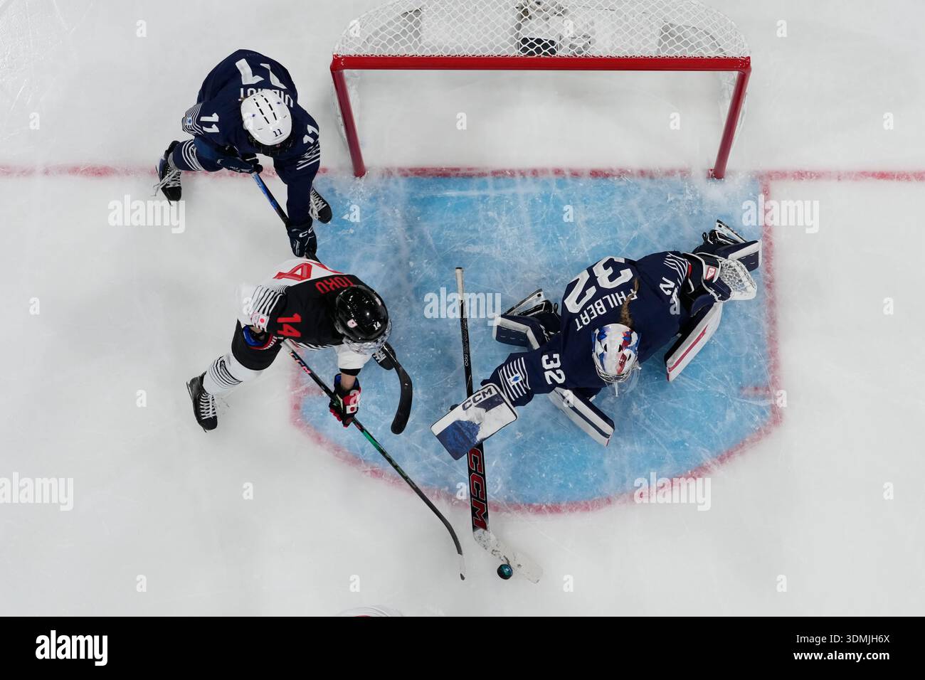 France's Alice Philbert, right, makes a save during a preliminary round ...